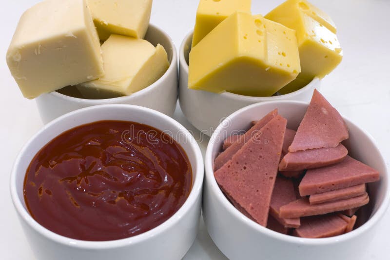 Toppings of a Basic Ham and Cheese Pizza - Processed and Cheddar Cheese ...