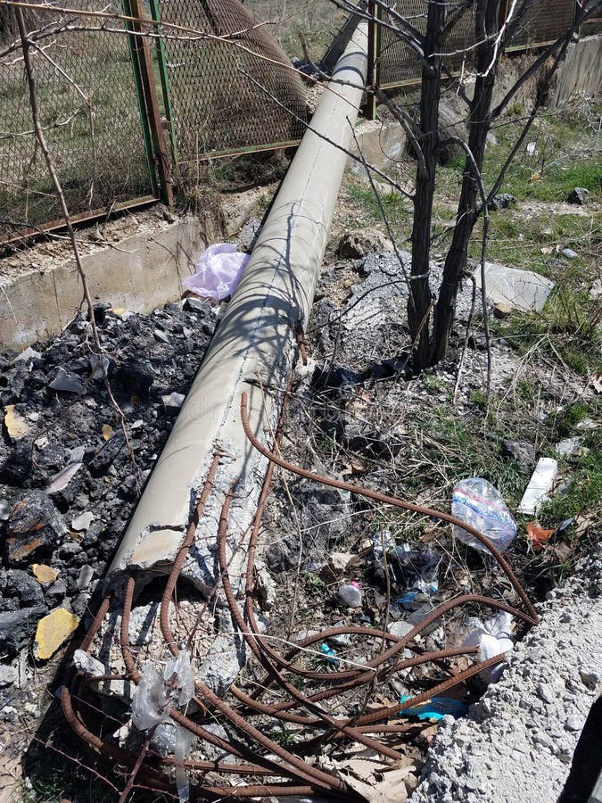 A Toppled Concrete Power Line Pole on the Ground Stock Photo - Image of ...