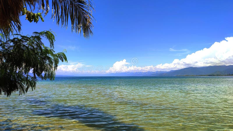 Torau beach, lake poso stock photo. Image of poso, beach - 276067792