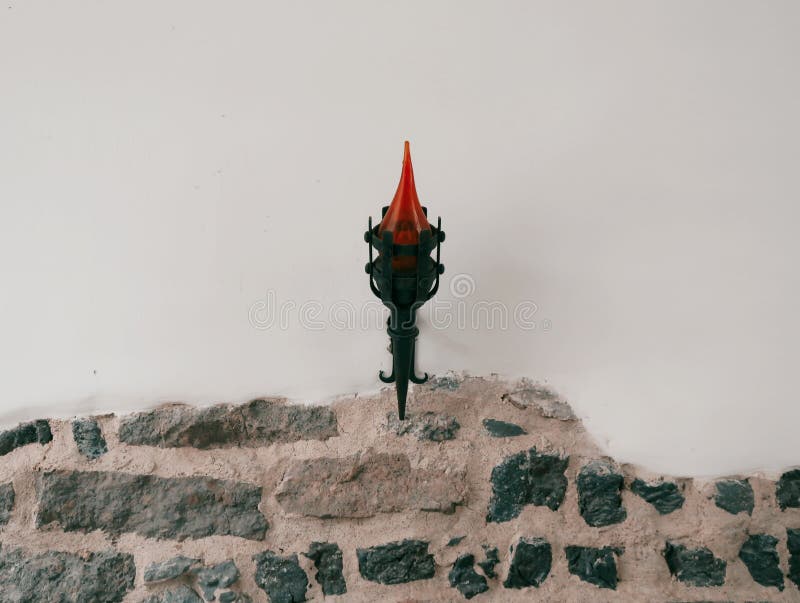 Torch lamp on the wall stock photo. Image of statue - 252610586