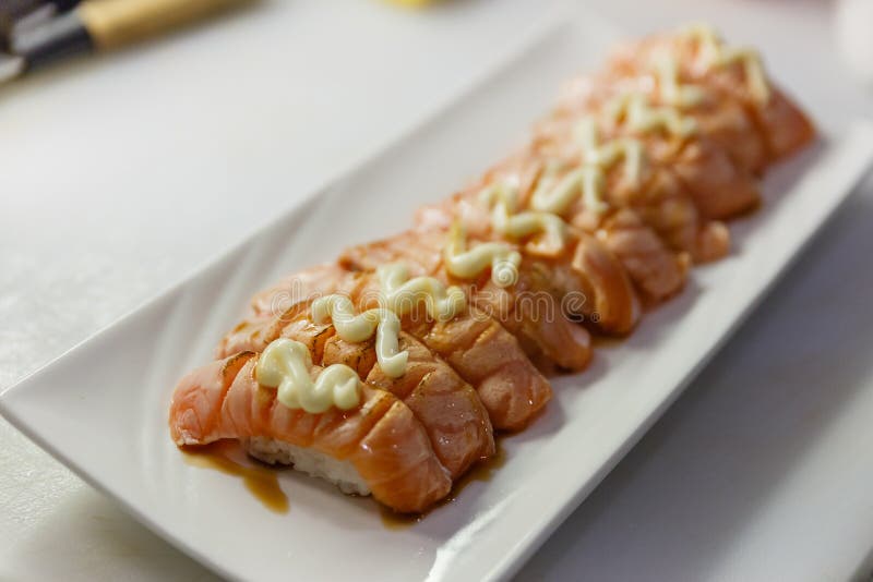 Torched Salmon Sushi with Medium Rare Cooked. Topping with Mayongnes ...