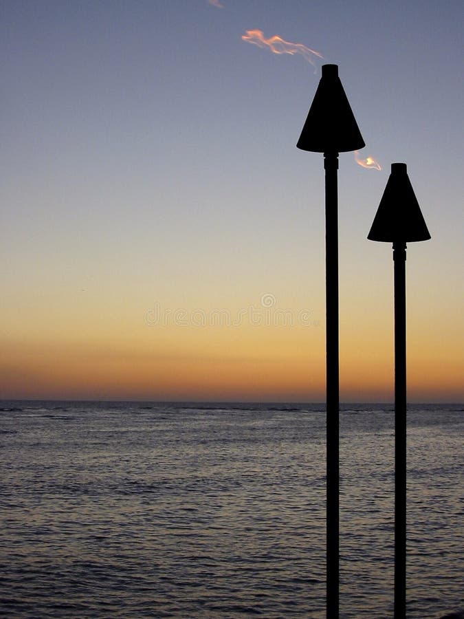 Torches stock photo. Image of torches, evening, ocean, oahu - 235618