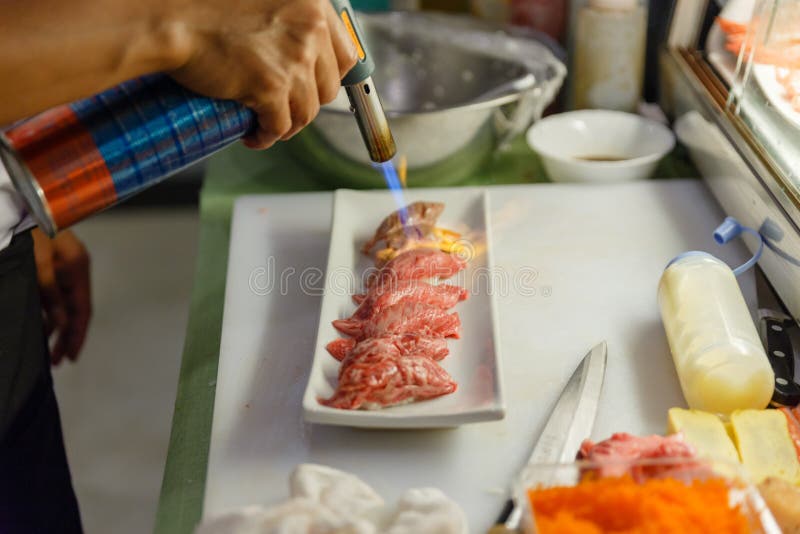 Torching Wagyu Sushi for Medium Rare Cooked Stock Image - Image of chef ...