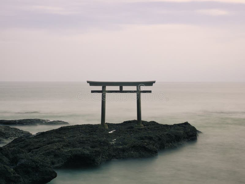 A Torii or a Shinto Gateway Shrine Gate on the Rock in the Sea Stock ...