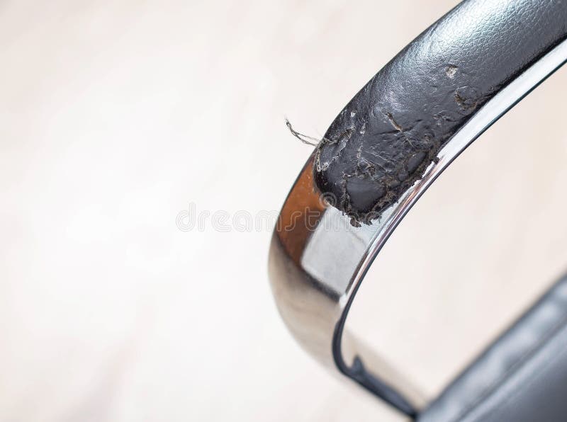 Torn and Battered Leather Back of the Sofa. Poor Quality Leather ...