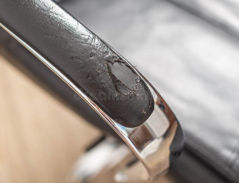 Torn and Battered Leather Back of the Sofa. Poor Quality Leather ...