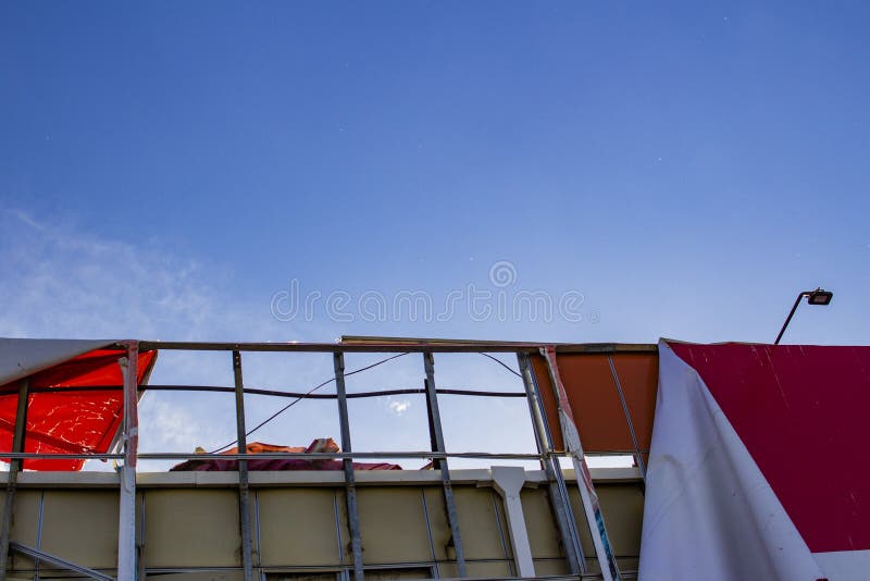 Torn Billboard Developing in the Air Against the Blue Sky Stock Image ...