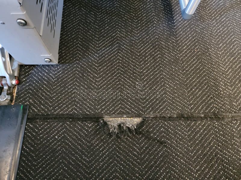 Torn Black Carpet or Rug in Floor of Airplane Stock Photo - Image of ...