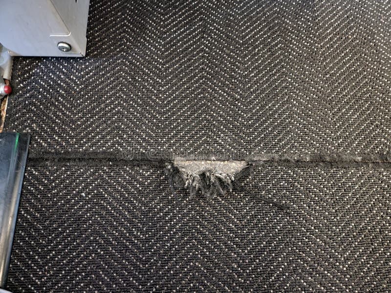 Torn Black Carpet or Rug in Floor of Airplane Stock Photo - Image of ...