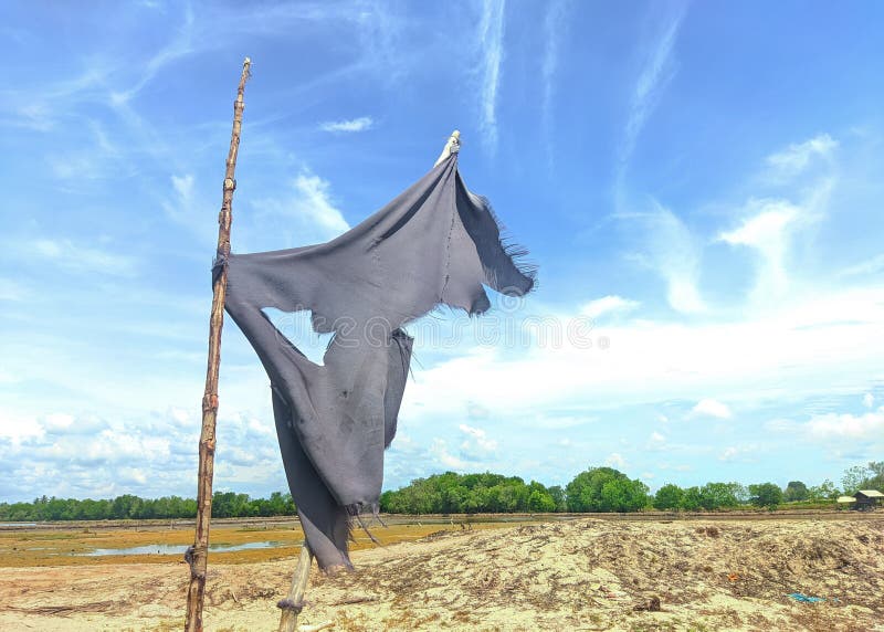 Torn Black Cloth Flag with Sky Background Stock Image - Image of bandit ...