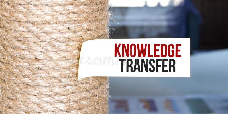 Torn Brown Paper on White Surface with Text KNOWLEDGE TRANSFER Word ...