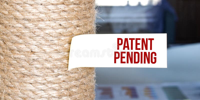 Torn Brown Paper on White Surface with Text Patent Pending Stock Image ...