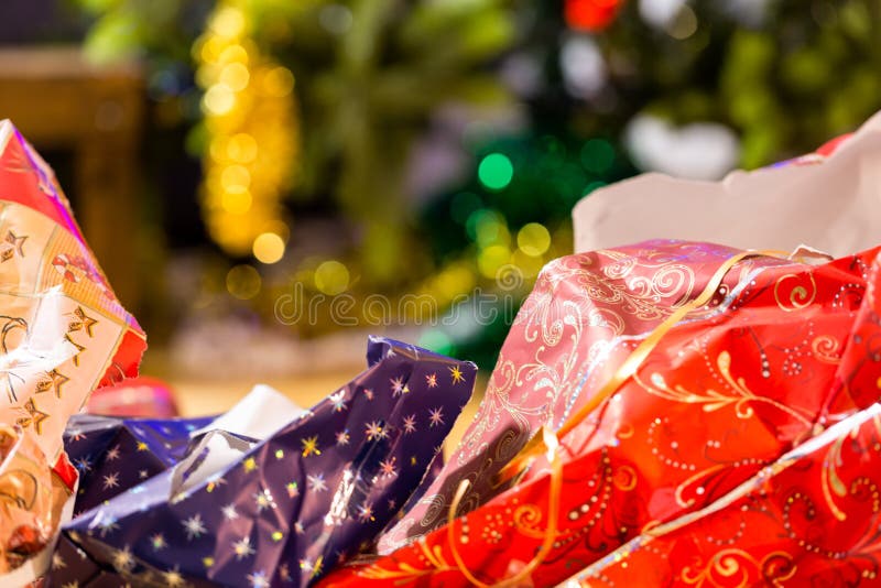 Torn Gift Paper from Christmas Gifts Under Christmas Tree Stock Photo ...