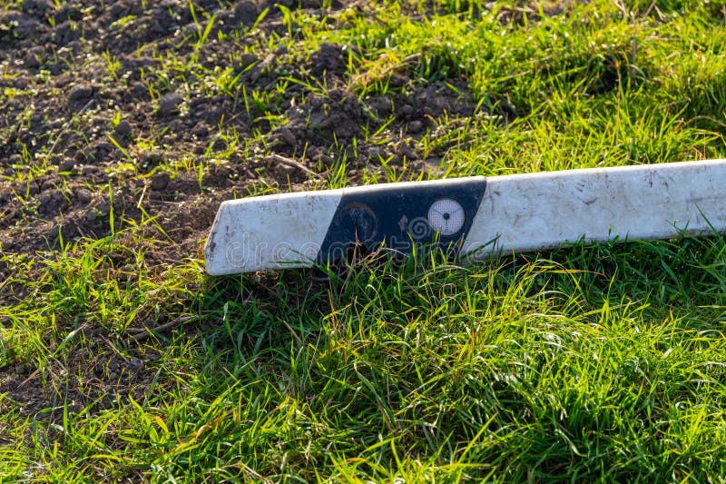 Demolished Delineator Post on a Field Stock Image - Image of turn ...