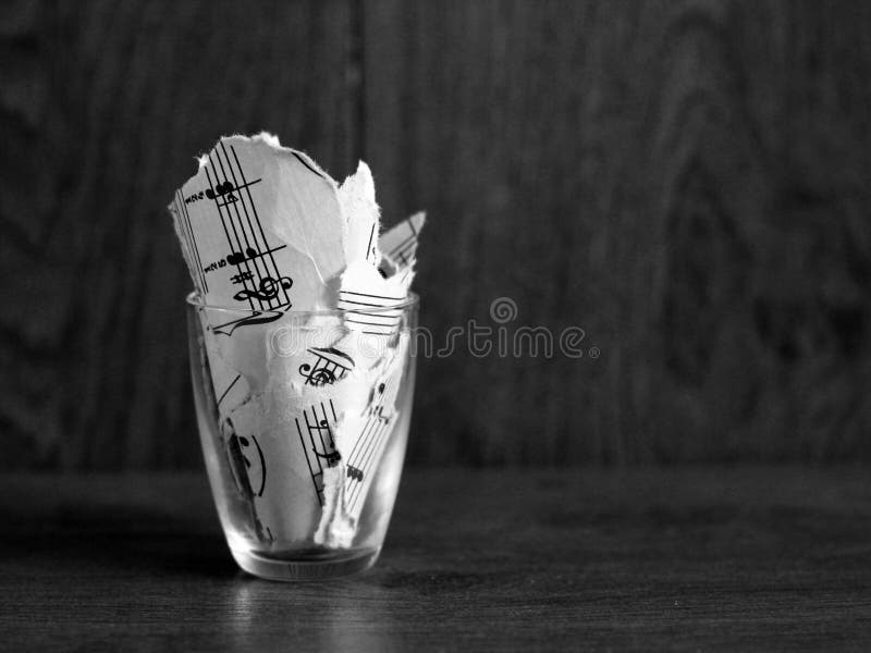 Torn Musical Notes in a Glass, Pieces of Paper Stock Image - Image of ...