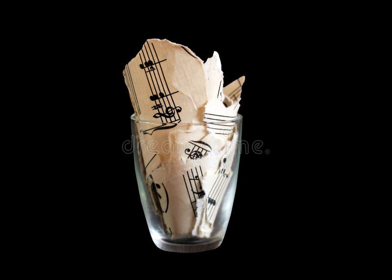 Torn Musical Notes in a Glass, Pieces of Paper, Isolated on Black Stock ...