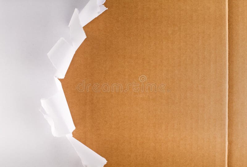 Torn Packaging Paper Revealing Cardboard Box Stock Photo - Image of ...