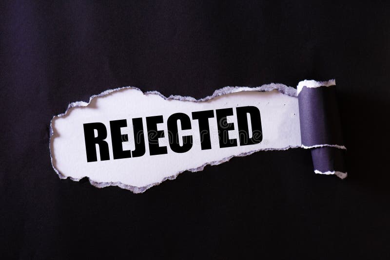 Top View of Black Torn Paper and the Text Rejected on a White ...
