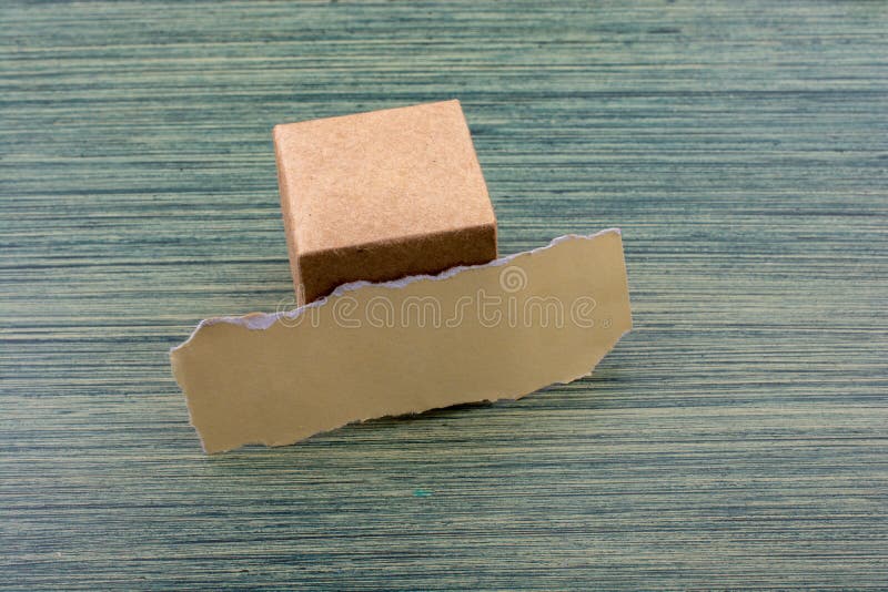 Torn Paper and a Paper Box Cube Stock Image - Image of horizontal ...