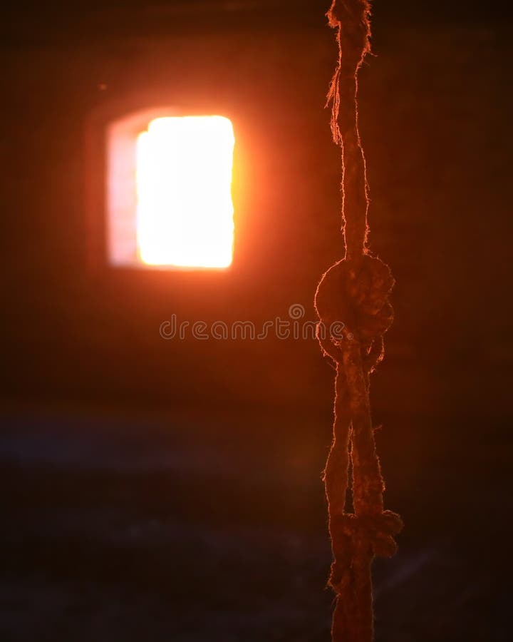 Torn Rope Hanging in Front of Bright Sunny Window Stock Photo - Image ...