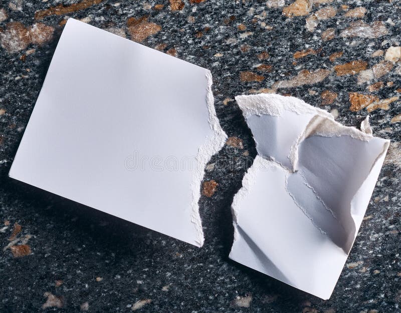 A Torn Sheet of Paper Lying on Polished Granite, Emphasizing Broken ...
