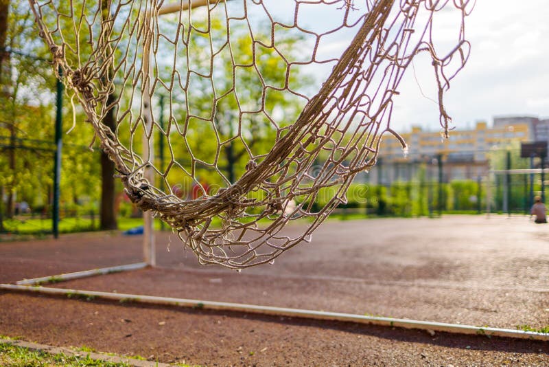 Torn Soccer Net Close-up on the Background of a Soccer Field Stock ...