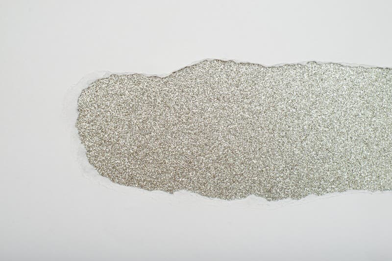 Torn White Paper Revealing a Silver Glitter Background Stock Image ...