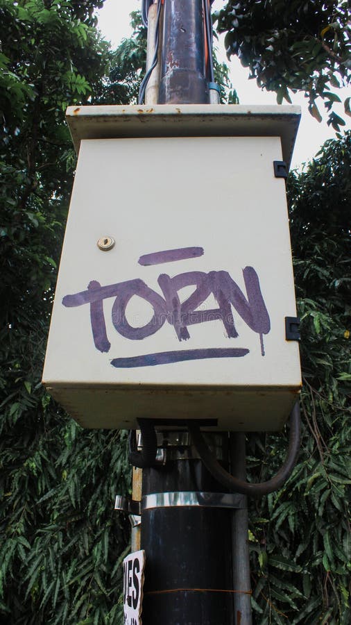 â€œTornâ€ Word Graffiti on a Small Electrical Box Stock Photo - Image ...