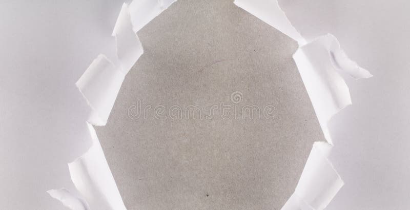 Torn Wrapping Paper Revealing Cardboard Box Stock Photo - Image of ...