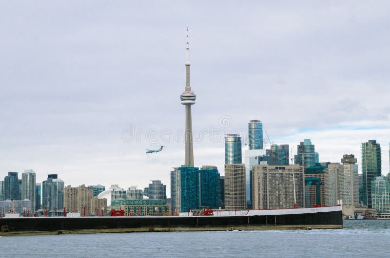 Toronto Skyline View from Toronto Island with a Plane Flying Editorial ...