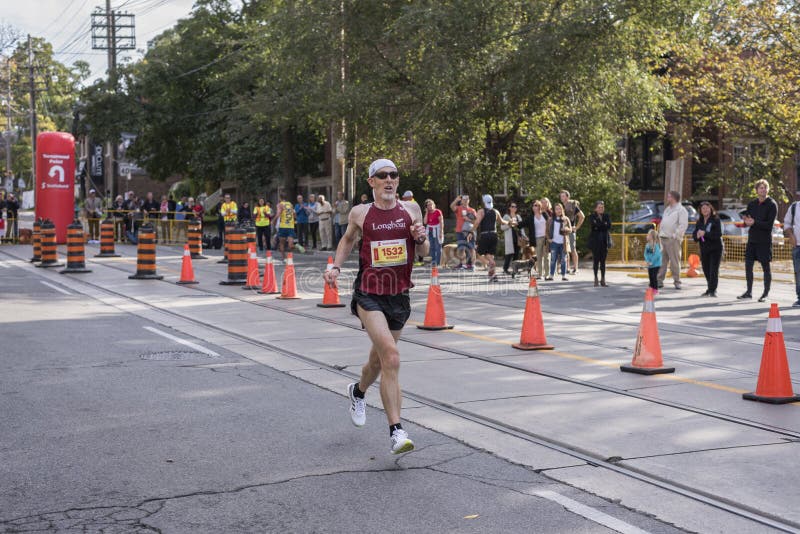 TORONTO, on/CANADA - OCT 22, 2017: Marathon Runner Robert Passing the ...