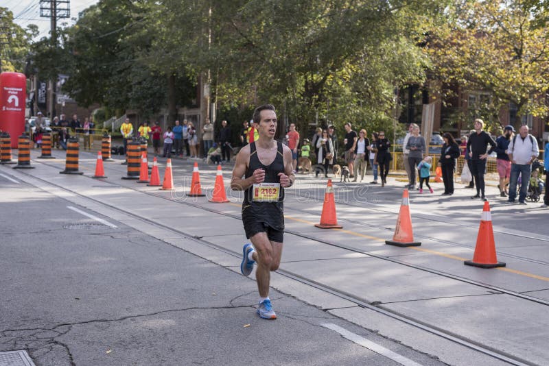 TORONTO, on/CANADA - OCT 22, 2017: Marathon Runner Robert Passing the ...