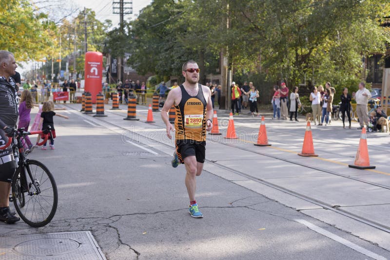 TORONTO, on/CANADA - OCT 22, 2017: Marathon Runner Simon Passing ...