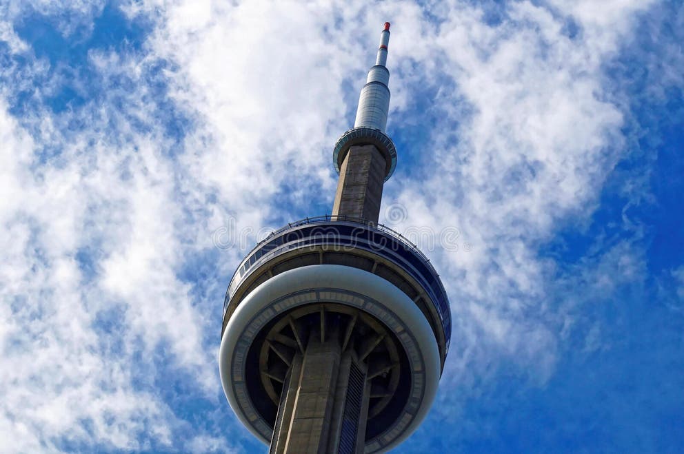Toronto Needle. CN Tower Spire Piercing Blue Sky of Toronto Editorial ...