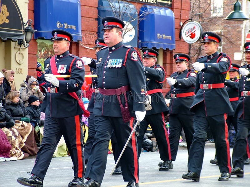 Toronto Mounted Police Officers Wave To Viewers Along the Queen Street ... Toronto Mounted Police Officers Wave To Viewers Along the Queen Street ...