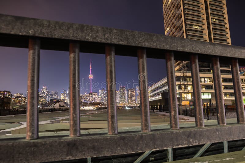 The Toronto Skyline and CN Tower at Night, Seen through a Bridge ...