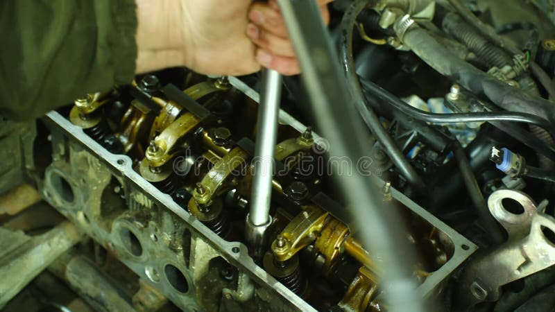 Torque Wrench Clicks As Technician Secures Engine Cylinder Head Bolts ...