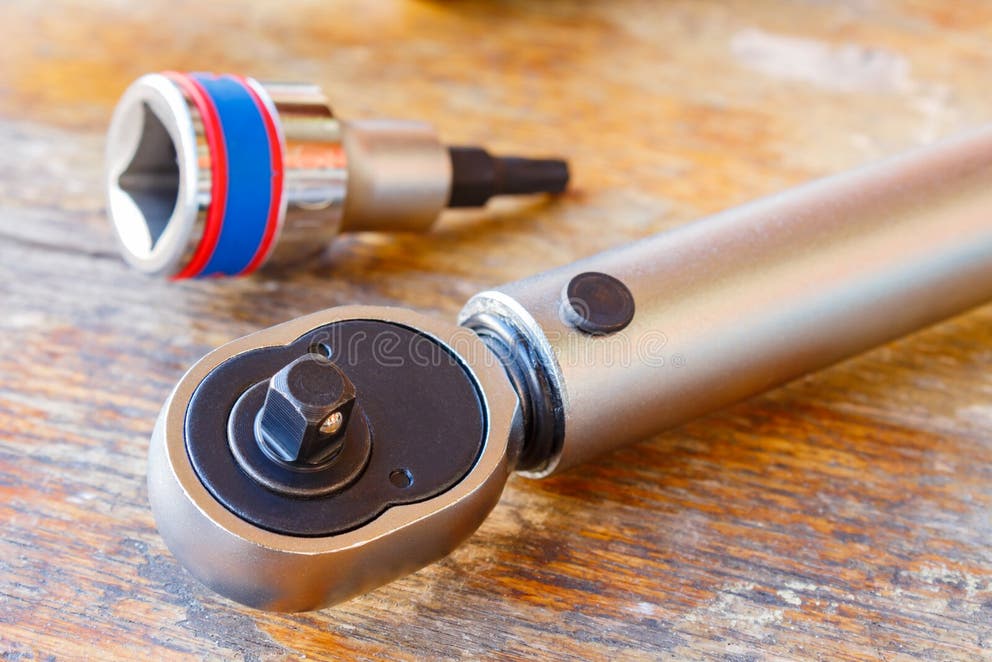 Torque Wrench and Spanner Head on a Wooden Table in the Workshop Stock ...