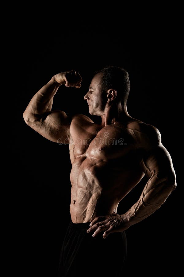 Torso of Attractive Male Body Builder on Black Background. Stock Photo ...
