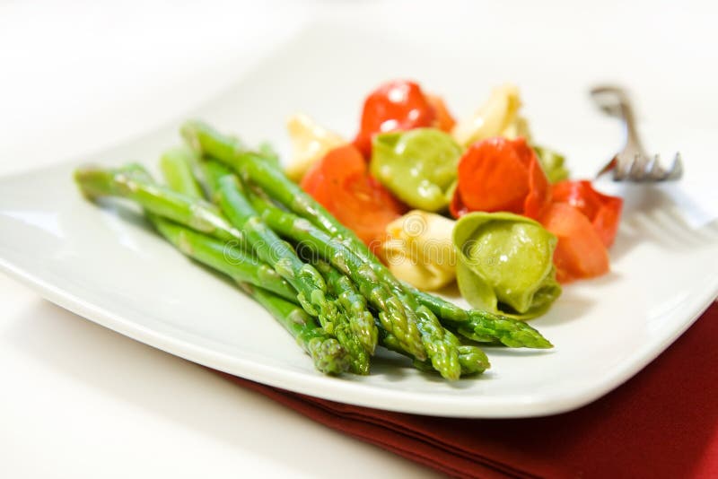 Tortellini and Asparagus stock image. Image of flatware - 12659927