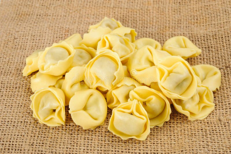 Pasta Pile on Pastel Pink Surface. Cute Shape of Raw, Uncooked Pasta on ...