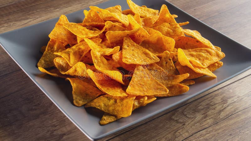 Tortilla Chips Filling a Rotating Rectangular Plate Stock Video - Video ...
