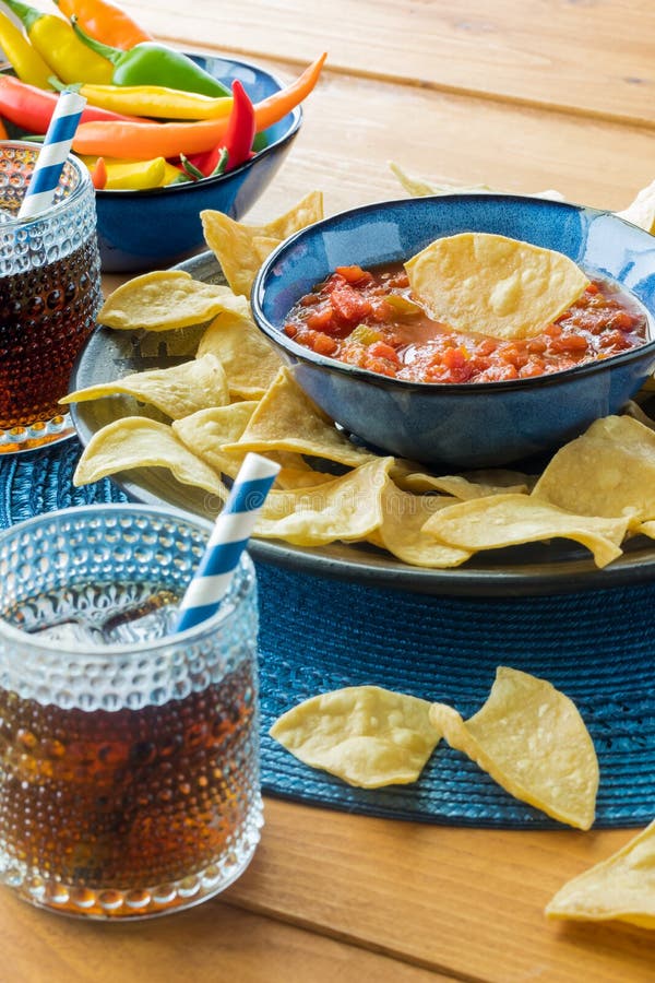 Tortilla Chips and Salsa Surrounded by Colourful Chilli Peppers. Stock ...