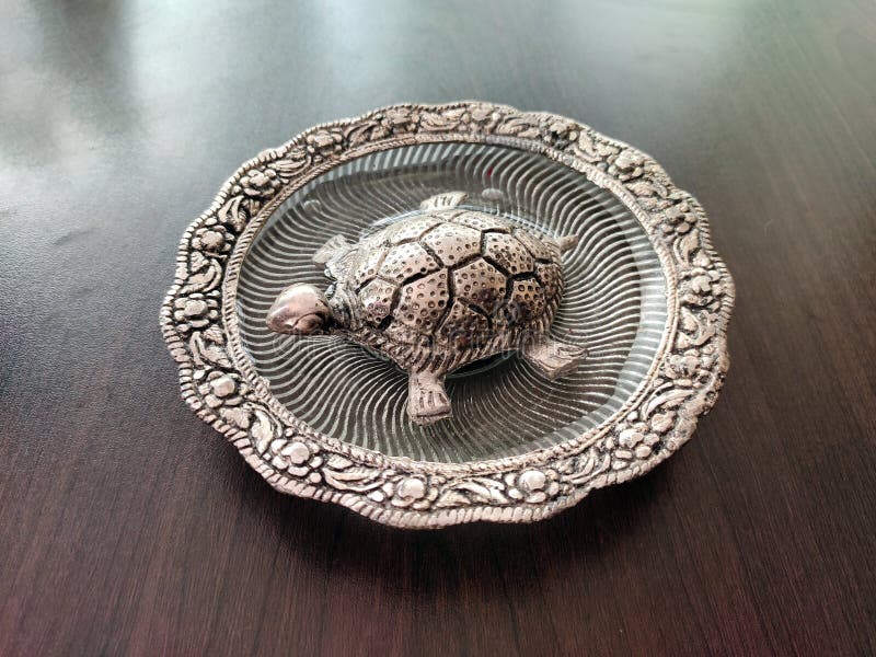 A Gleaming Silver Tortoise, Its Shell Intricately Detailed, Submerged ...