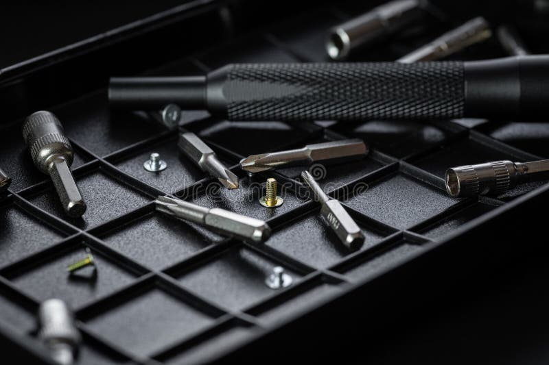 Torx Drive Bit and Aluminum Bit Driver on Black Sorting Tray. Screws ...