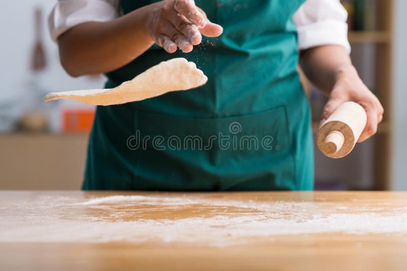 Tossing pizza dough stock image. Image of culinary, cropped - 50319609
