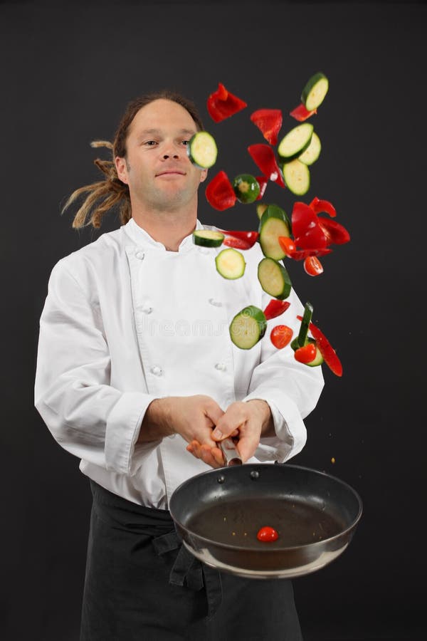 Chef adding ingredients stock image. Image of corn, hand - 25469623