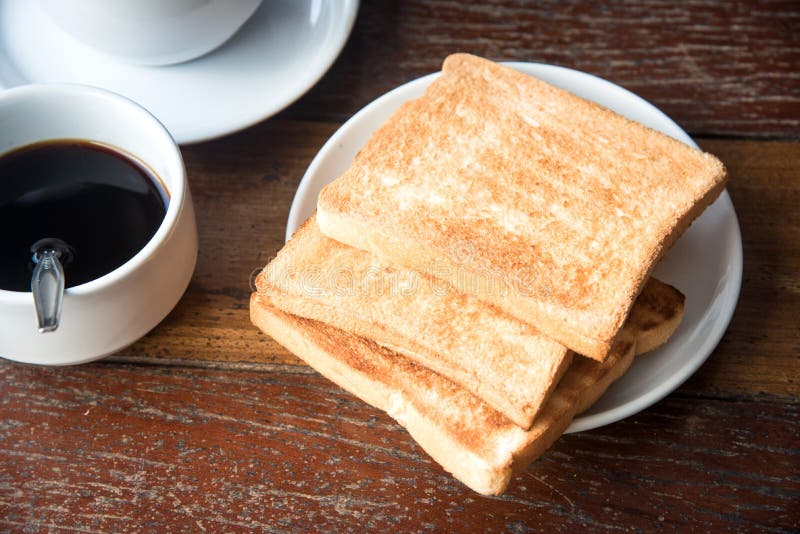 Desayune Con La Tostada Y El Café En La Tabla De Madera Imagen de ...