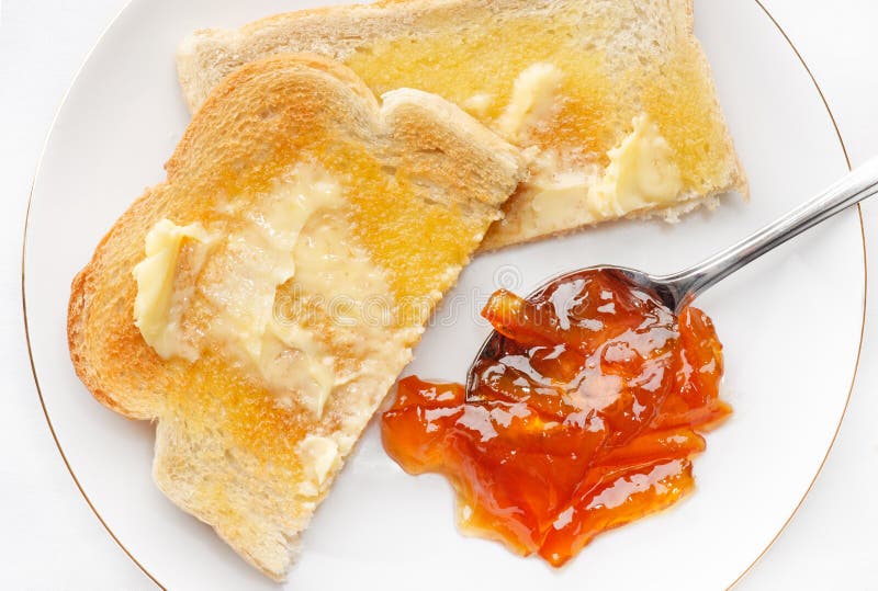 Tostada Y Mermelada Untadas Con Mantequilla Calientes Imagen de archivo ...