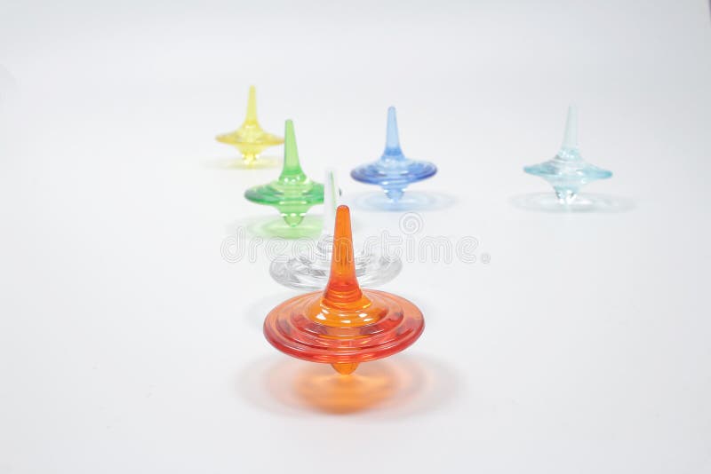 A Totem Spinning Tops Spinning, Wobbling and Stopping Stock Photo ...